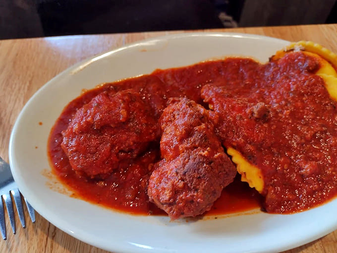 These meatballs aren't just food; they're edible time machines transporting you straight to Sunday dinner at your Italian grandmother's house.