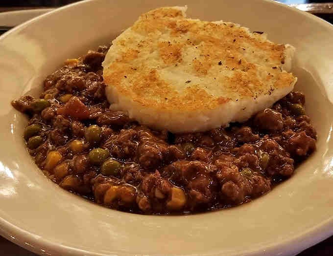 Comfort in a bowl &ndash; hearty shepherd's pie accompanied by freshly baked soda bread, the perfect tool for capturing every last drop of gravy.