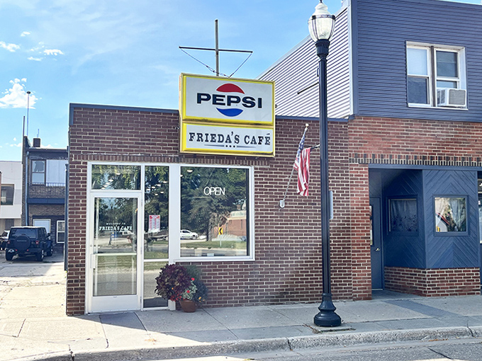 Frieda's Cafe in Willmar keeps it simple with its classic brick exterior and vintage Pepsi sign, focusing on what matters most: the food.