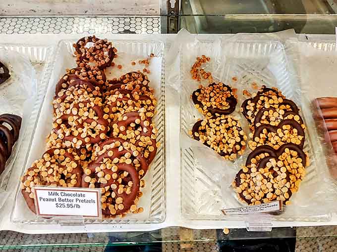 Chocolate-covered pretzels with generous nut toppings strike that perfect sweet-salty balance that keeps you reaching for "just one more."