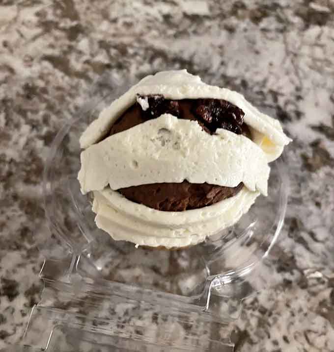 Layers of cake and frosting stacked like the world's most delicious architecture project gone delightfully right.