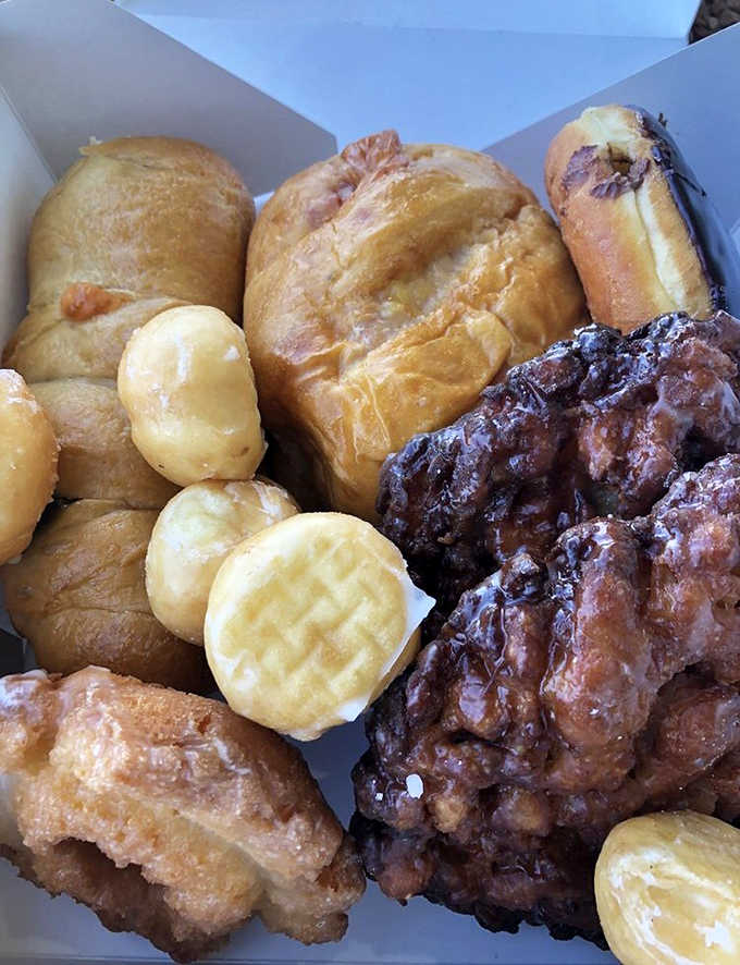 A box of joy! These assorted donuts represent the perfect balance of variety and quality that keeps locals coming back.