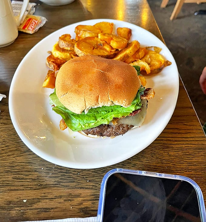Bacon Cheeseburger: This isn't fast food's distant cousin &ndash; it's the burger your dreams are made of, with golden potato wedges standing guard.