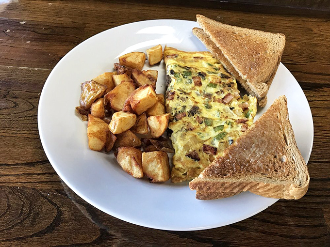 This omelet and home fries combo proves that sometimes the simplest pleasures are the most satisfying.