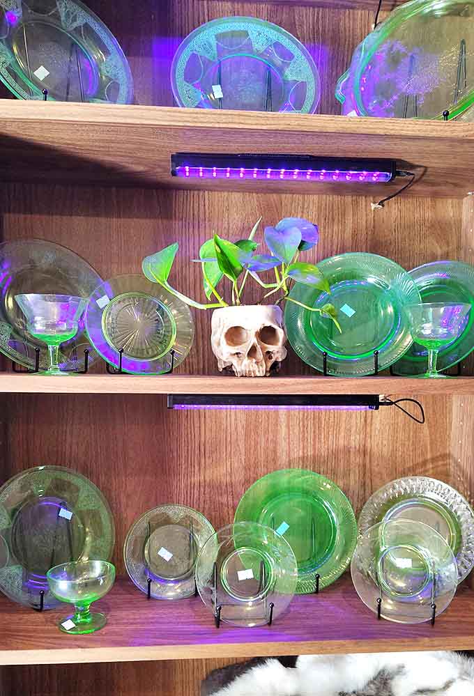 Under purple lights, vintage glassware transforms from ordinary Depression-era collectibles into otherworldly treasures that seem to capture and hold the surrounding light.