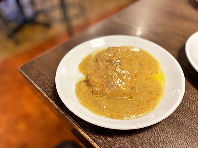 Biscuits swimming in savory gravy &ndash; comfort food that wraps around you like your grandmother's hug after a long absence.