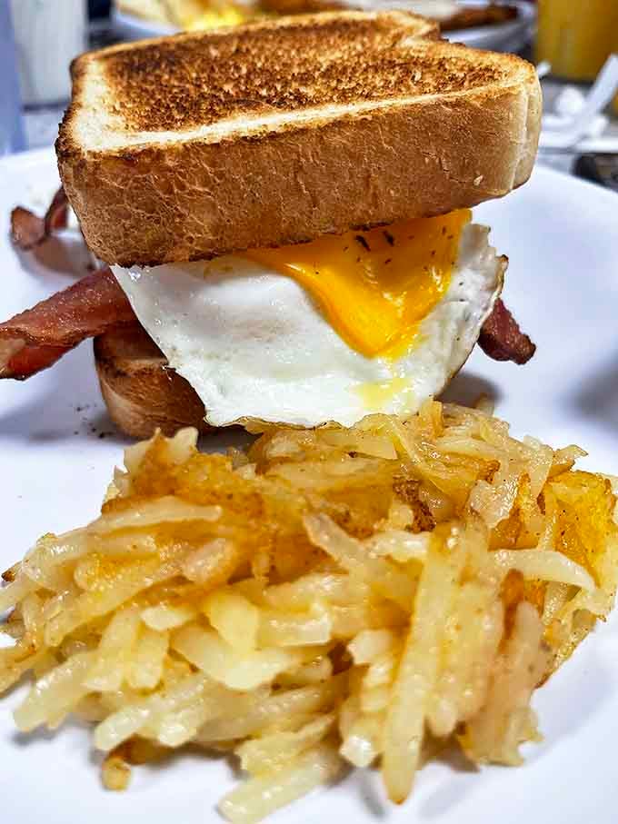 Breakfast sandwich architecture at its finest &ndash; that yolk is about to create the sauce of your dreams.