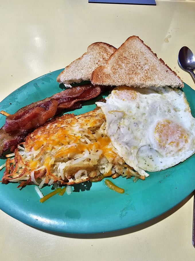Classic breakfast done right &ndash; crispy hash browns, perfectly cooked eggs, and bacon that would make any morning better.