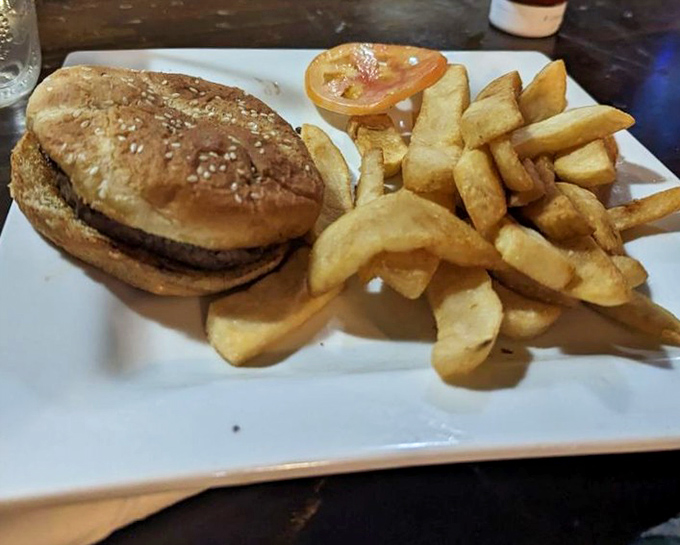 A classic burger served with golden fries &ndash; simple food executed perfectly. The sesame seed bun adds that satisfying crunch to complement the juicy patty.