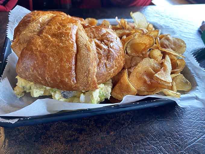 The chicken salad croissant delivers homemade goodness on buttery pastry, accompanied by crispy house-made chips.