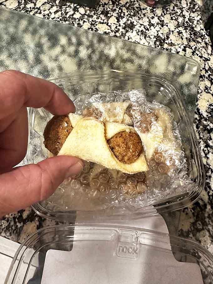These delicate pastry triangles cradle their sweet fillings like precious cargo, each bite offering the perfect balance of buttery dough and filling.