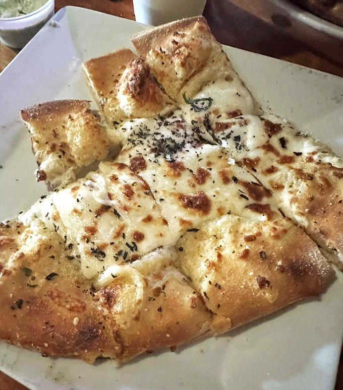 Cheesy bread that's golden, garlicky, and generously portioned, because sometimes simple pleasures are the best pleasures.