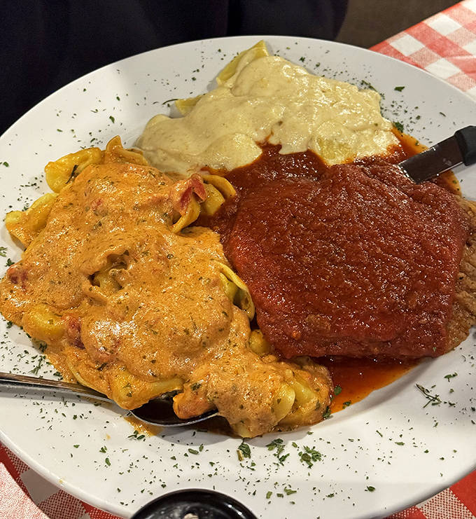 A holy trinity of pasta perfection, featuring three distinct sauces that transform simple chicken parmesan into an Italian-American flavor symphony.