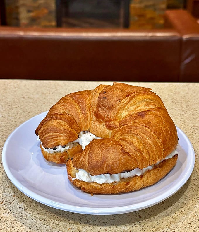 A croissant sandwich that elevates lunch from mundane to magnificent &ndash; proof that chicken salad finds its highest purpose between layers of flaky pastry.