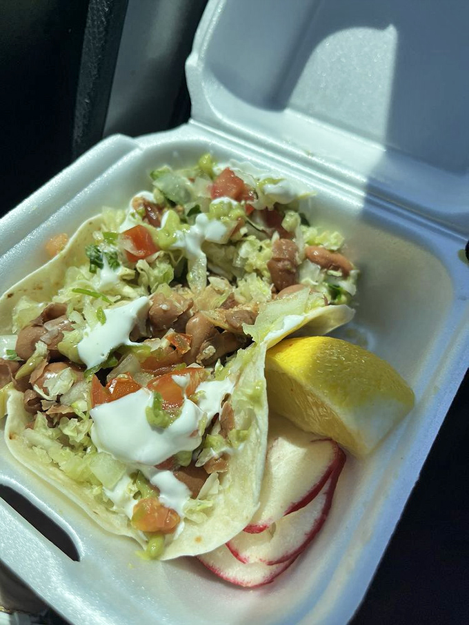 A perfect handheld delight featuring tender chicken, fresh veggies, and a squeeze of lime – proof that good things come in simple packages.