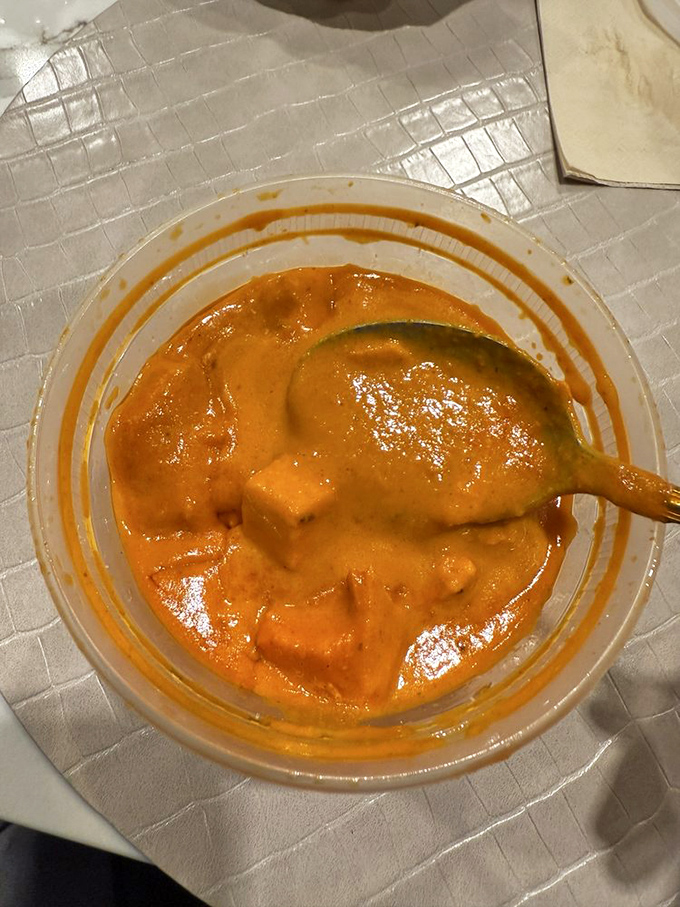 This chicken tikka masala isn't just orange &ndash; it's a sunset-hued pool of spiced goodness that demands to be sopped up with naan.