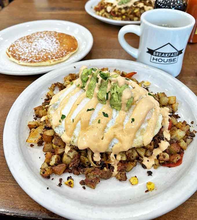 Perfectly poached eggs crown the chorizo hash like breakfast royalty, ready to release their golden treasure.