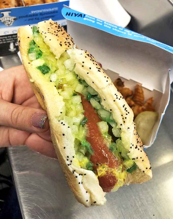 This classic Chicago dog showcases the art of hot dog architecture – every ingredient perfectly placed for maximum flavor in every bite.
