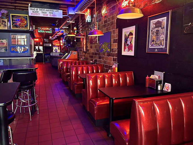 Classic diner aesthetics meet arcade energy in these cozy red booths &ndash; the perfect command center for your burger and gaming operations.