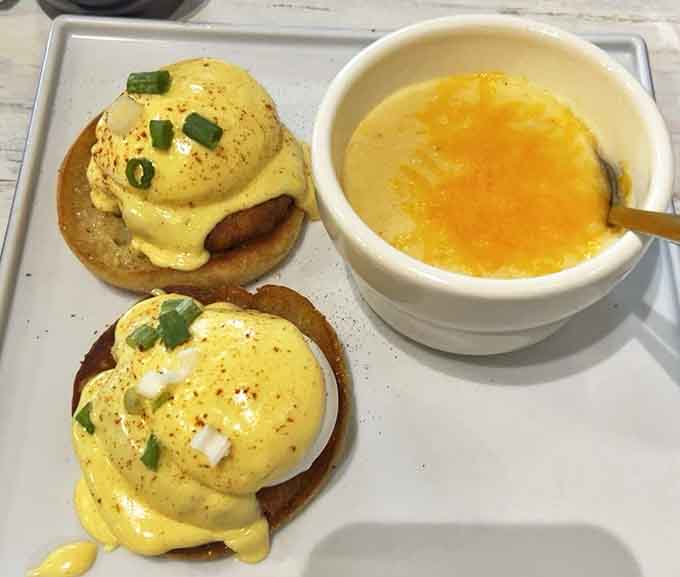 The ultimate Southern comfort combo: Crab Cakes Benedict paired with creamy cheese grits that would make even the most stoic diner shed a tear of joy.