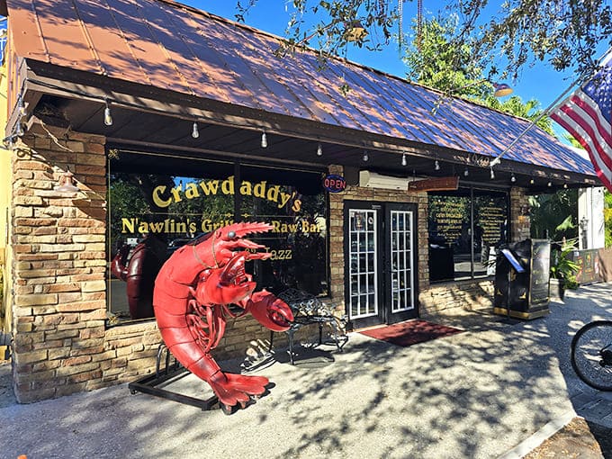 Crawdaddy's iconic red crawfish sculpture welcomes hungry visitors to this local institution where Cajun flavors meet Florida seafood.