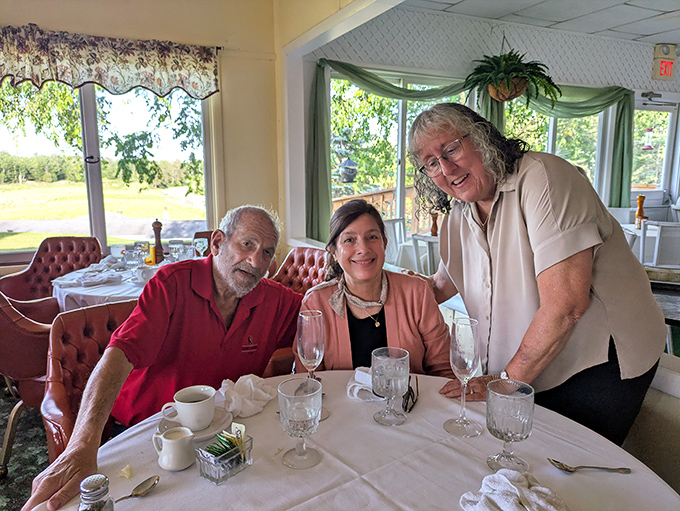 Happy diners enjoying the Dam Site experience. Those smiles aren't just politeness &ndash; they're the universal expression of chicken satisfaction.