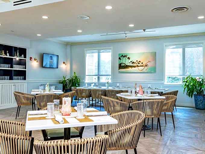 Coastal elegance defined: Natural light floods this dining space where seafood tastes fresher and conversations flow easier.