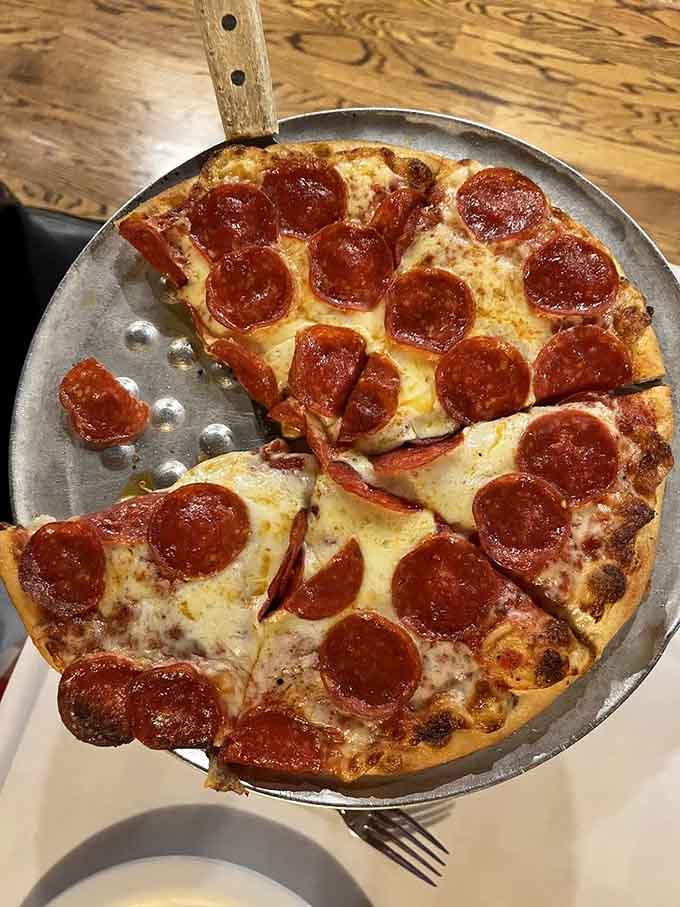 Pepperoni pizza in its purest form, where those little cups of spicy goodness create pools of flavor that make every bite an adventure.