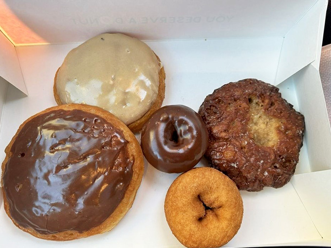 A baker's dozen of handcrafted happiness, each donut a testament to the early morning dedication happening behind the scenes.