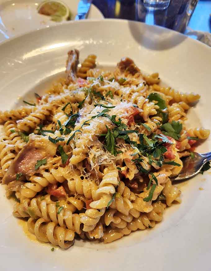 Each twirl of the fork brings another perfect bite, the kind that makes you close your eyes and forget your troubles for a moment.