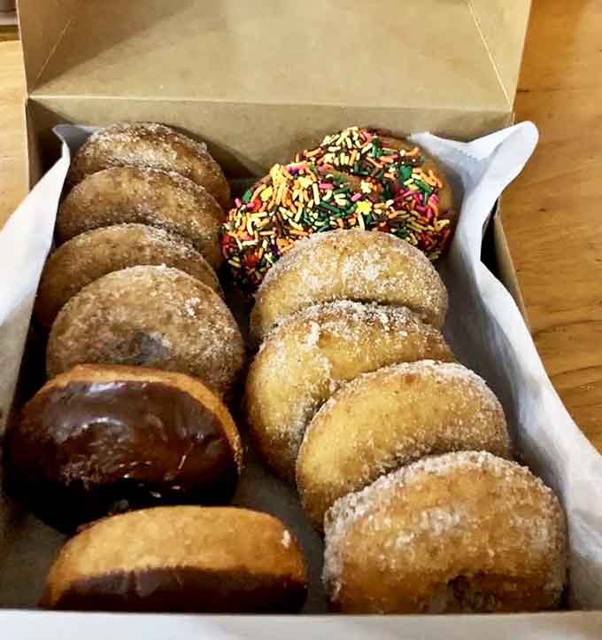 A box of fresh-made donuts that won't survive the car ride home – the ultimate test of willpower that most visitors gloriously fail.