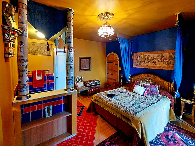 The Egyptian Room's crimson walls and authentic-looking sarcophagus create an unexpected portal to ancient times within medieval walls.