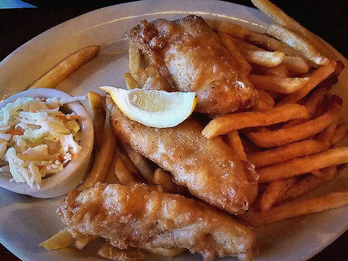 Golden-battered fish and chips that would make a British pub jealous, served with a side of coleslaw that's actually worth eating.