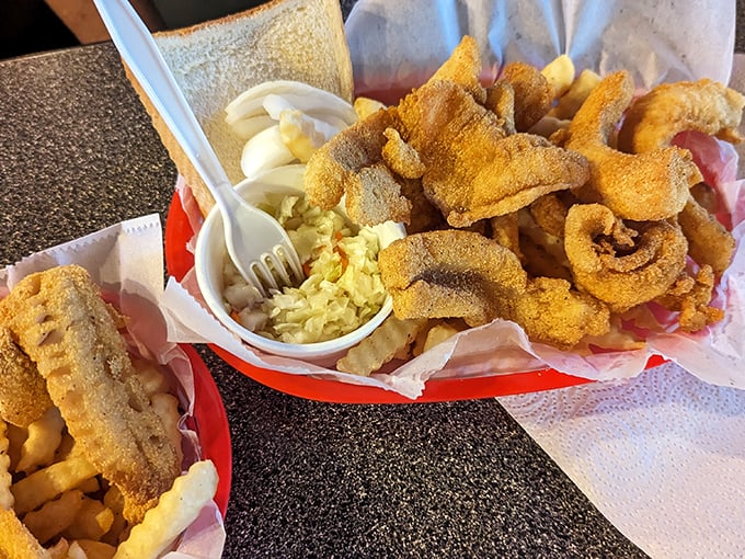 Seafood treasure nestled in paper-lined baskets. The fish extends beyond its boundaries, as all good country portions should.