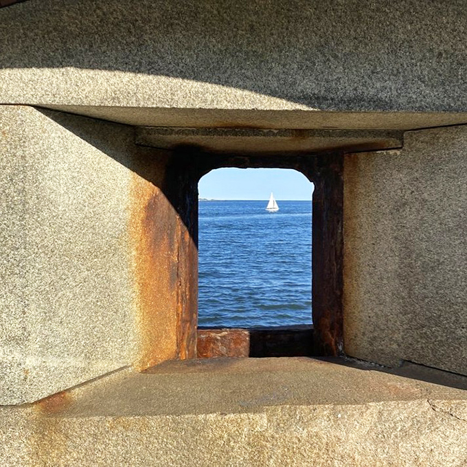 Nature frames a perfect sailing scene through this cannon window at Fort Preble, proving that sometimes the best views come with historical perspective.