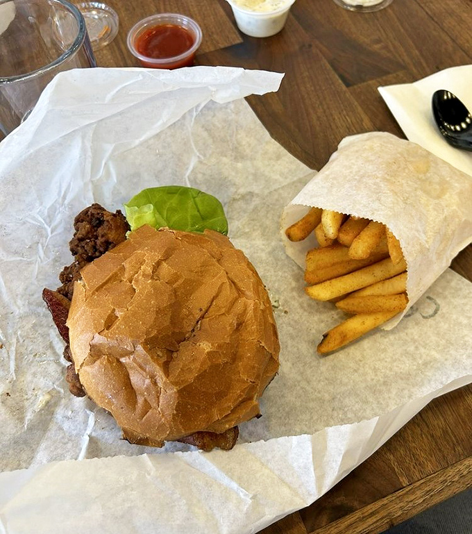 The humble paper wrapping can barely contain this masterpiece &ndash; a study in textural contrast between crispy coating and tender meat.