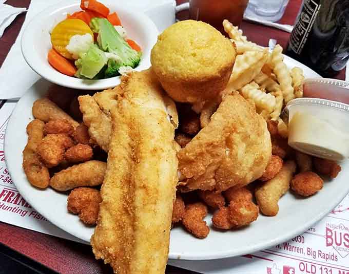 Golden-battered fish surrounded by crispy sides &ndash; proof that simple food done right is culinary magic.