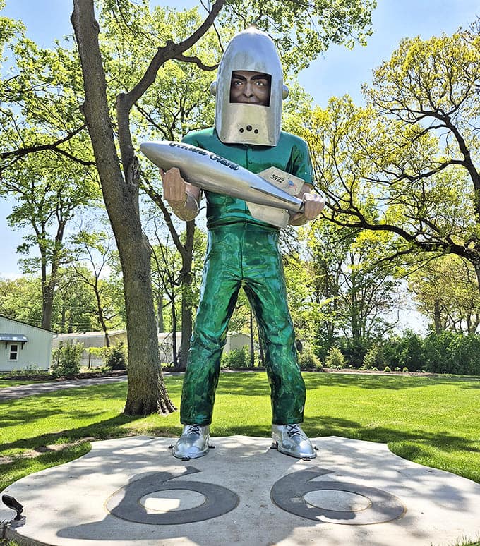 The Gemini Giant towers over Route 66, a fiberglass testament to America's space-age dreams and roadside attraction glory.