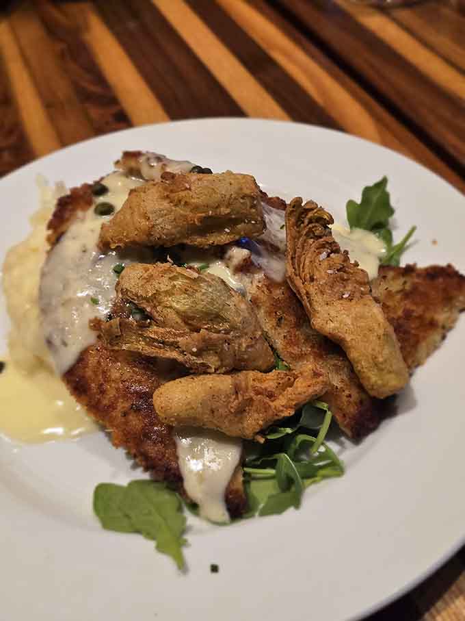 Parmesan-crusted chicken that's golden, crispy, and paired with fried artichokes because sometimes more is actually more.