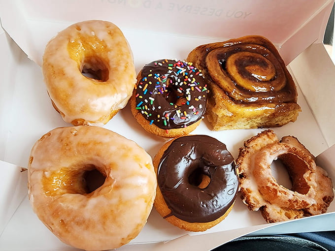 The humble glazed donut, elevated to art form &ndash; light, airy, and with that perfect sugar shell that shatters delicately with each bite.