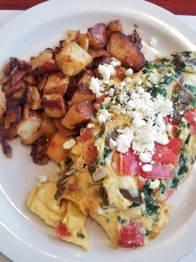 Feta cheese crumbles crown this Mediterranean masterpiece, proving that Greeks might have been onto something with their breakfast philosophy.