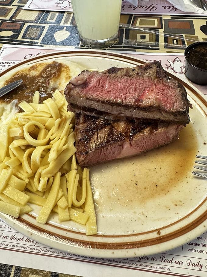 The prime rib arrives medium-rare and butter-tender, accompanied by buttered noodles that glisten under the diner's lights &ndash; simple perfection on a plate.