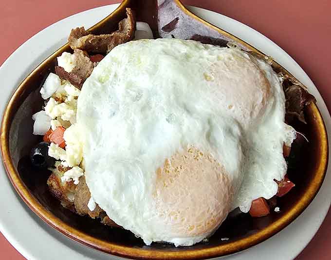 This skillet looks like someone took everything wonderful about breakfast and decided it all belonged together under a perfectly cooked egg.
