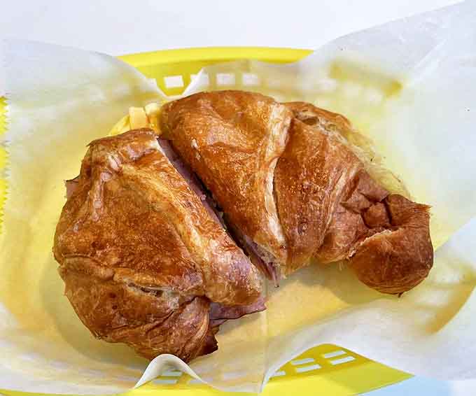 The ham and egg croissant looks like it's auditioning for a food magazine cover. Those buttery layers shatter with each bite, revealing savory treasures within.