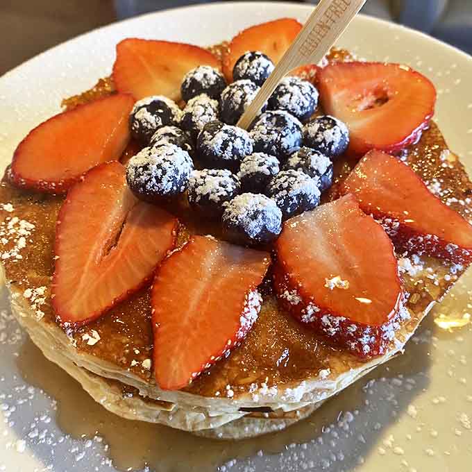 These gluten-free pancakes loaded with fresh berries look almost too pretty to eat, but you'll manage to overcome that obstacle somehow.