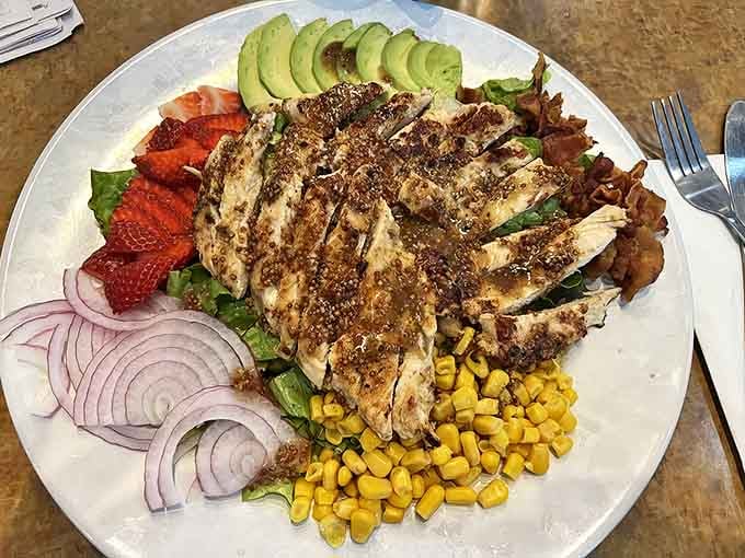 A colorful arrangement of grilled chicken, fresh strawberries, avocado, and corn &ndash; proof that "diner salad" doesn't have to be an oxymoron.