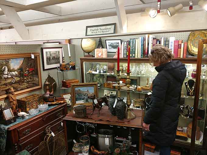 Fellow treasure hunters browse with the focused intensity of archaeologists on the verge of a major discovery.