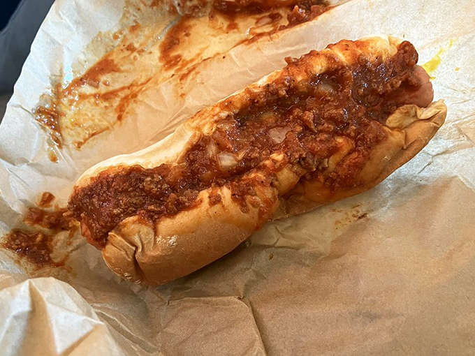 Simplicity perfected – this chili-smothered masterpiece proves that sometimes the most basic pleasures deliver the most profound satisfaction.