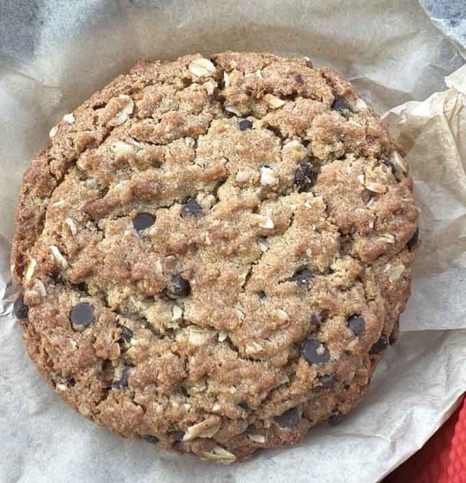 This chocolate chip cookie is so large it practically qualifies as a personal pizza, and nobody's complaining about that.