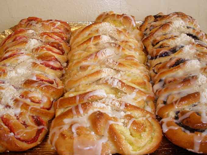 Fruit-swirled coffee cakes with glaze dripping down like sweet waterfalls, because subtlety is overrated when butter and sugar are involved.